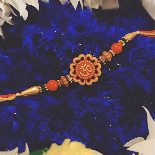 Buy House of Festivals Mauli Rakhi - With Om Pendant & Pearl Beads ...