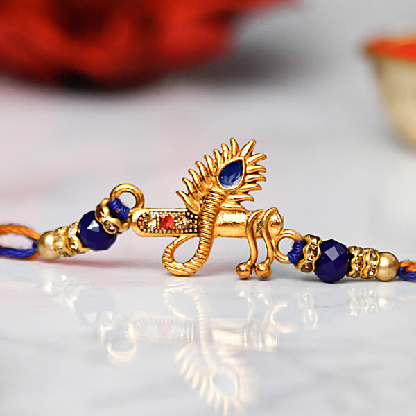 Buy eCraftIndia Designer Mor Pankh With Flute Rakhi Online at Best ...